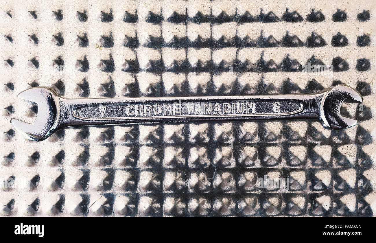 Abstract composition of metal wrench and surface Stock Photo - Alamy