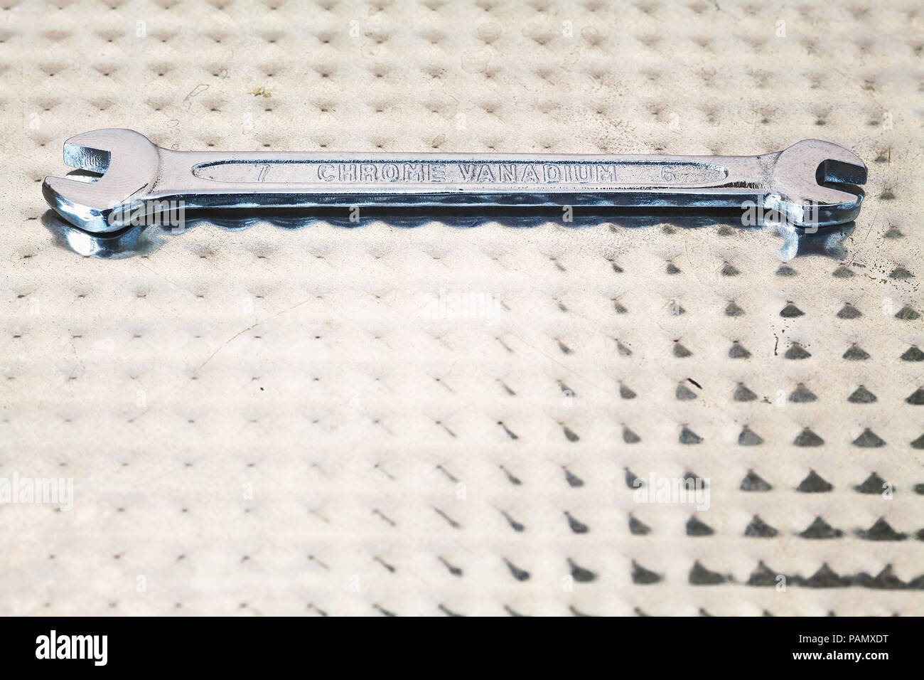 Abstract composition of metal wrench and surface Stock Photo - Alamy