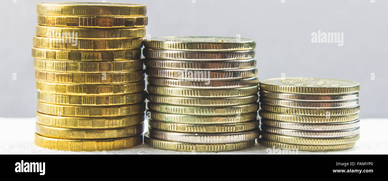Stacks of Russian coins on a gray background with droplets of water ...