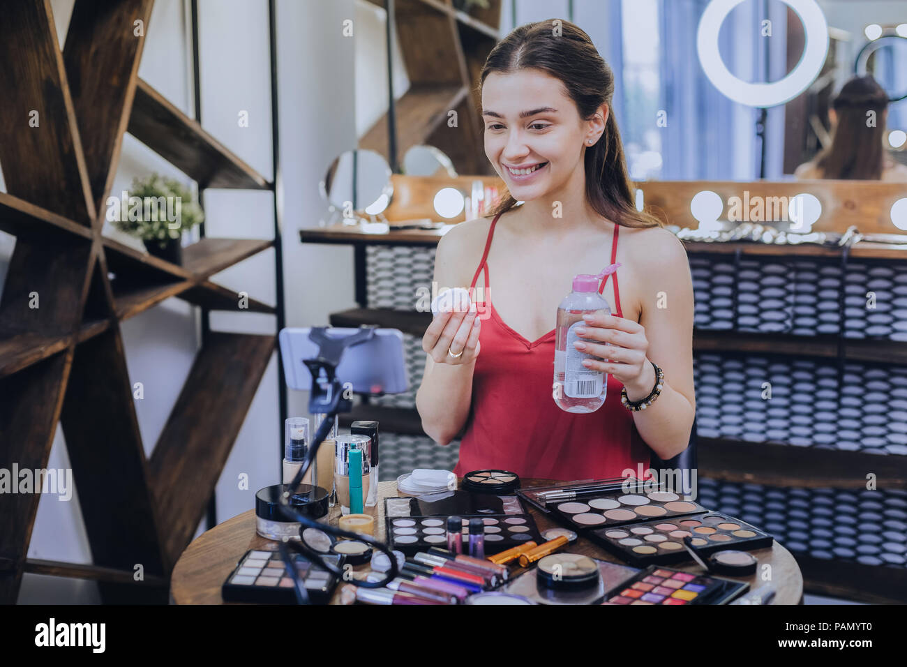 Beautiful young businesswoman taking her makeup off Stock Photo - Alamy