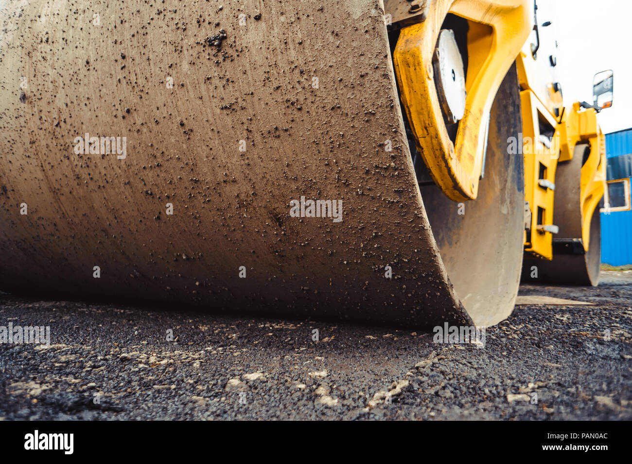 Road construction works with roller compactor machine and asphalt ...