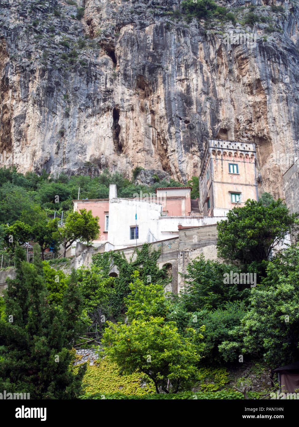 Houses cling to the side of a cliff face at Amalfi, Italy Stock Photo ...