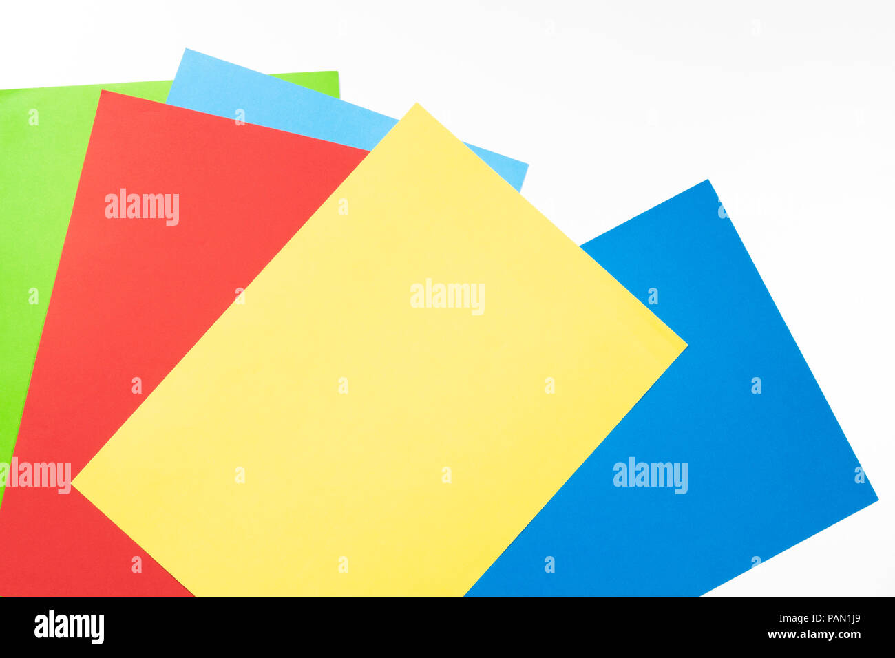 Colourful paper sheets on white background Stock Photo - Alamy