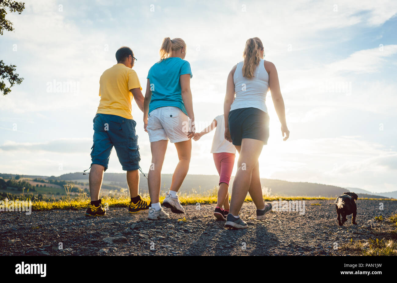 Children parents walking home hi-res stock photography and images - Alamy