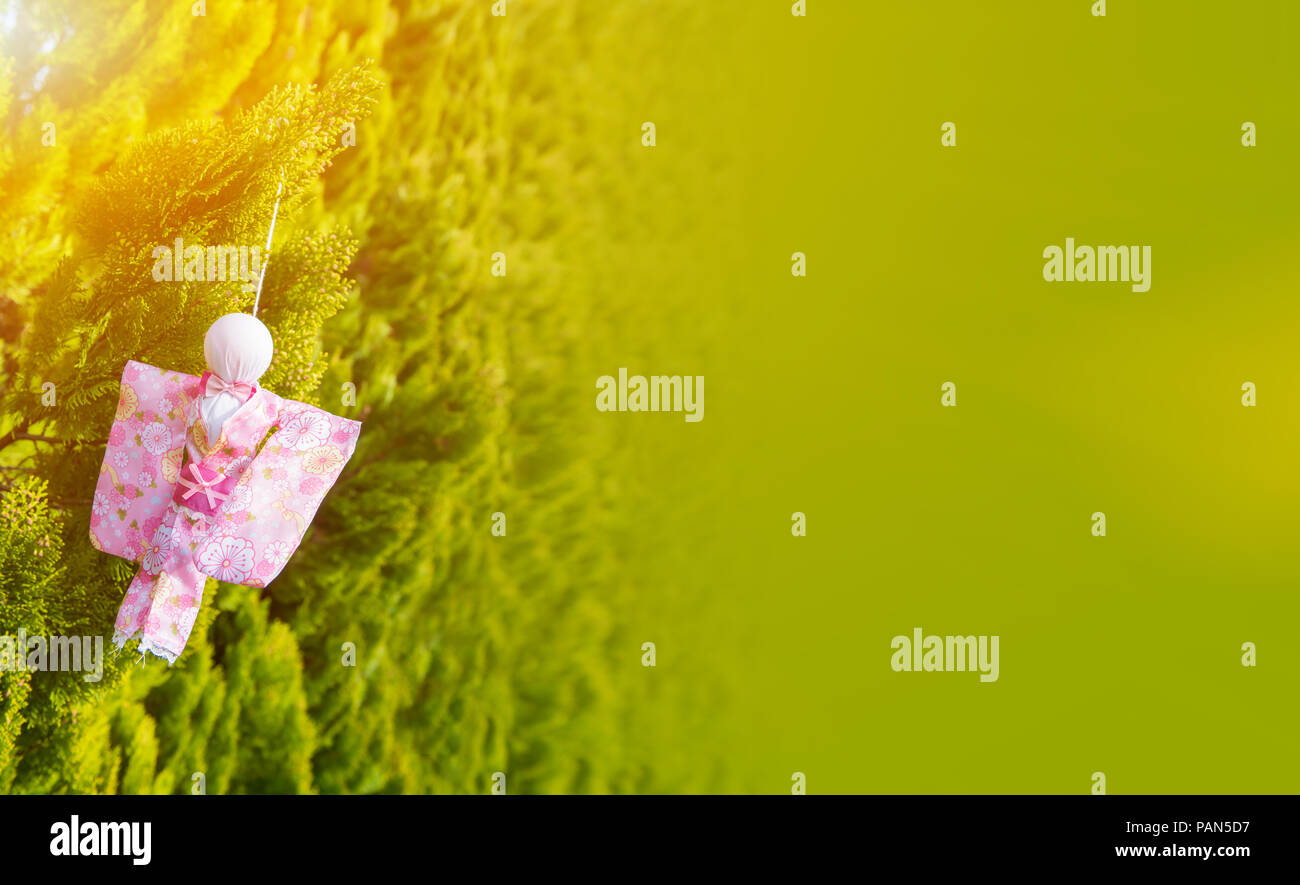 Teru Teru Bozu. Japanese Rain Doll wearing kimono, hanging on tree to ...