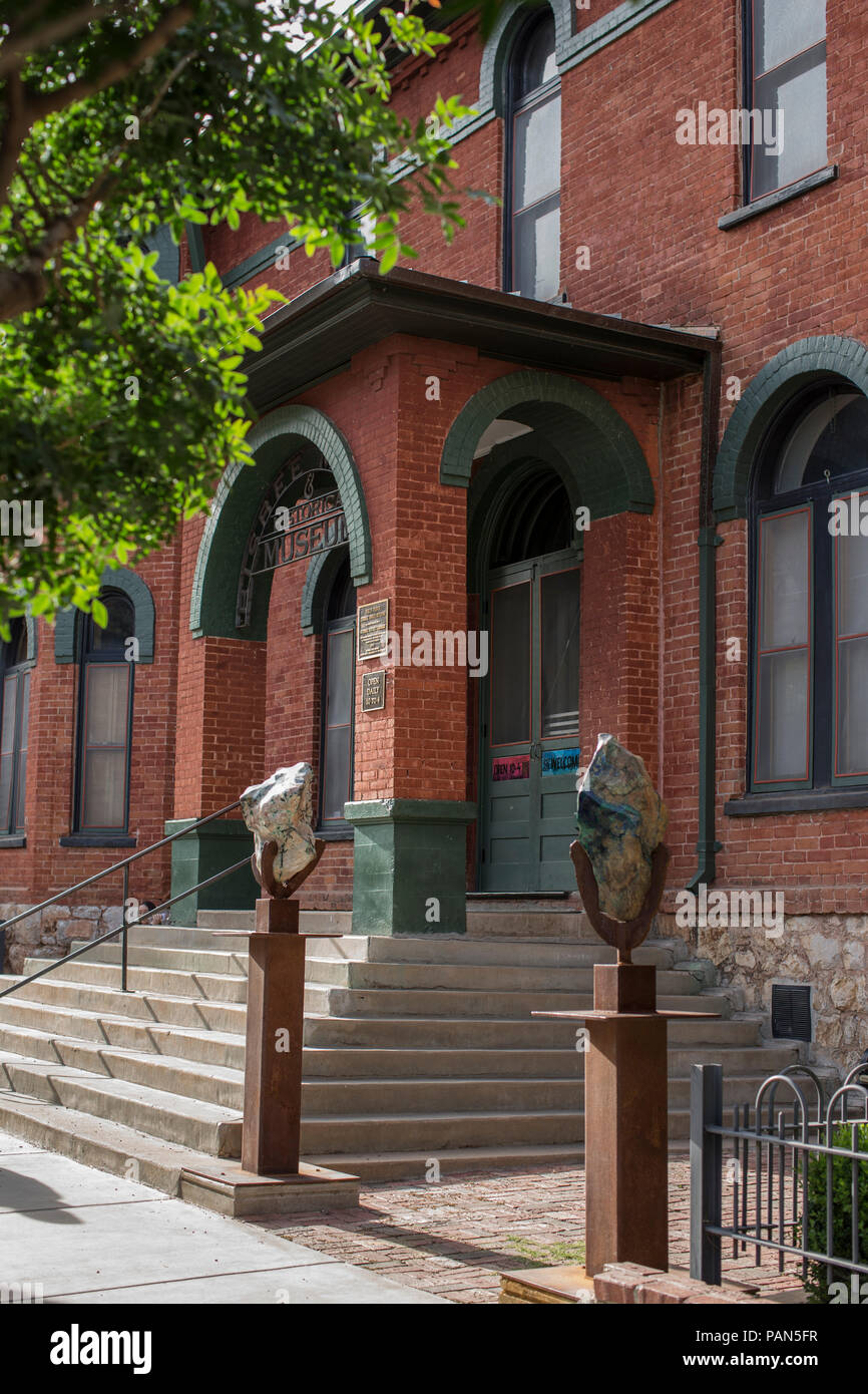 Red brick building with black iron fence. Historical Mining and Mineral ...