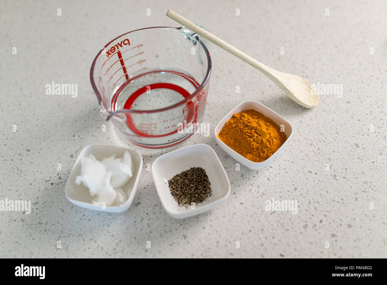 golden paste ingredients on countertop Stock Photo - Alamy