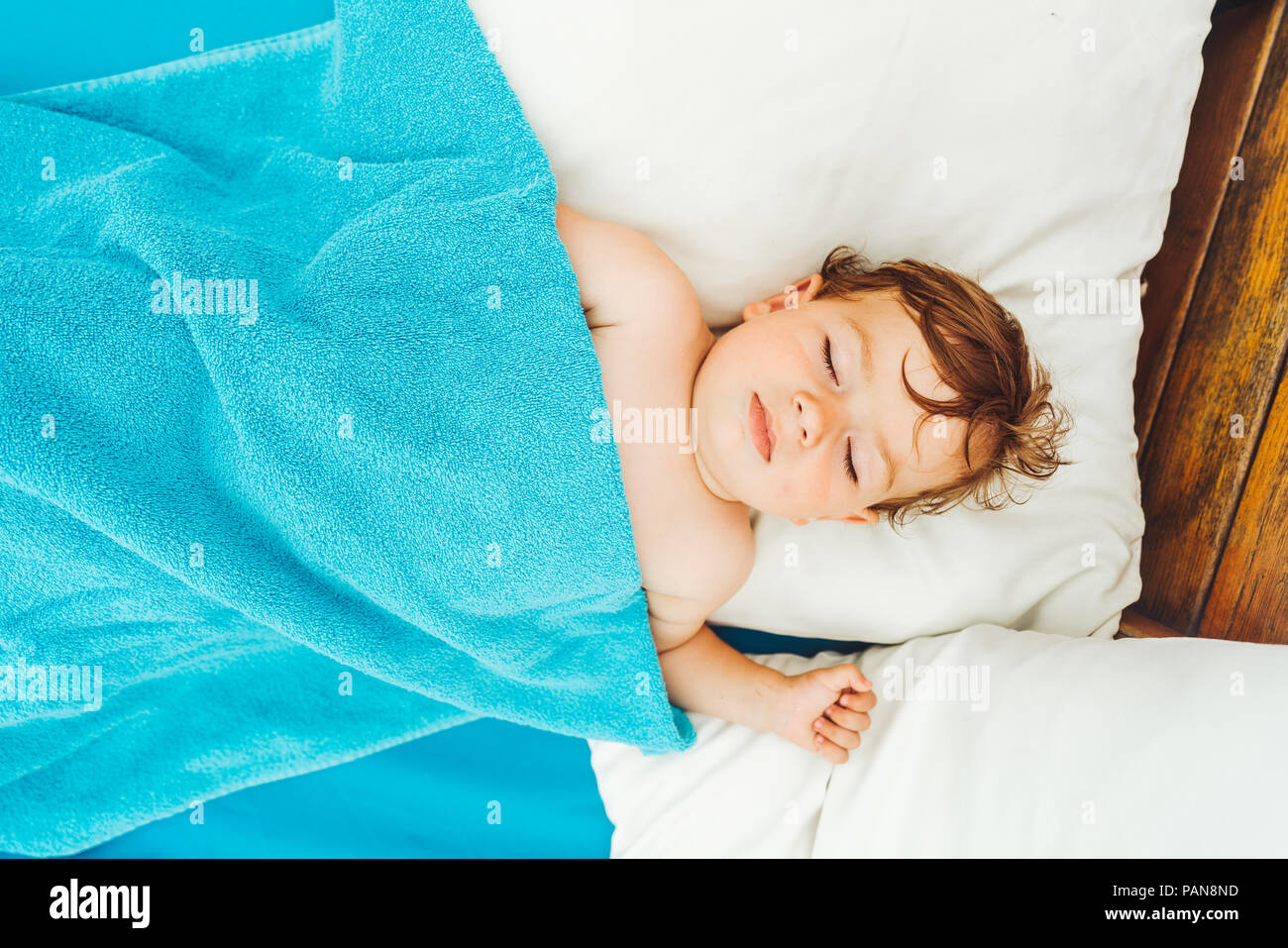 Adorable boy sleeping in bed Stock Photo - Alamy