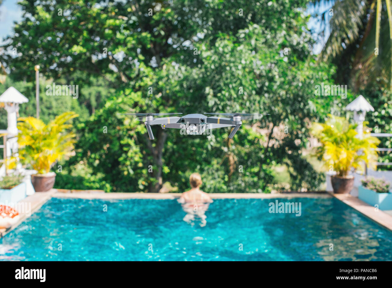 Flying drone over swimming pool hi-res stock photography and images - Alamy