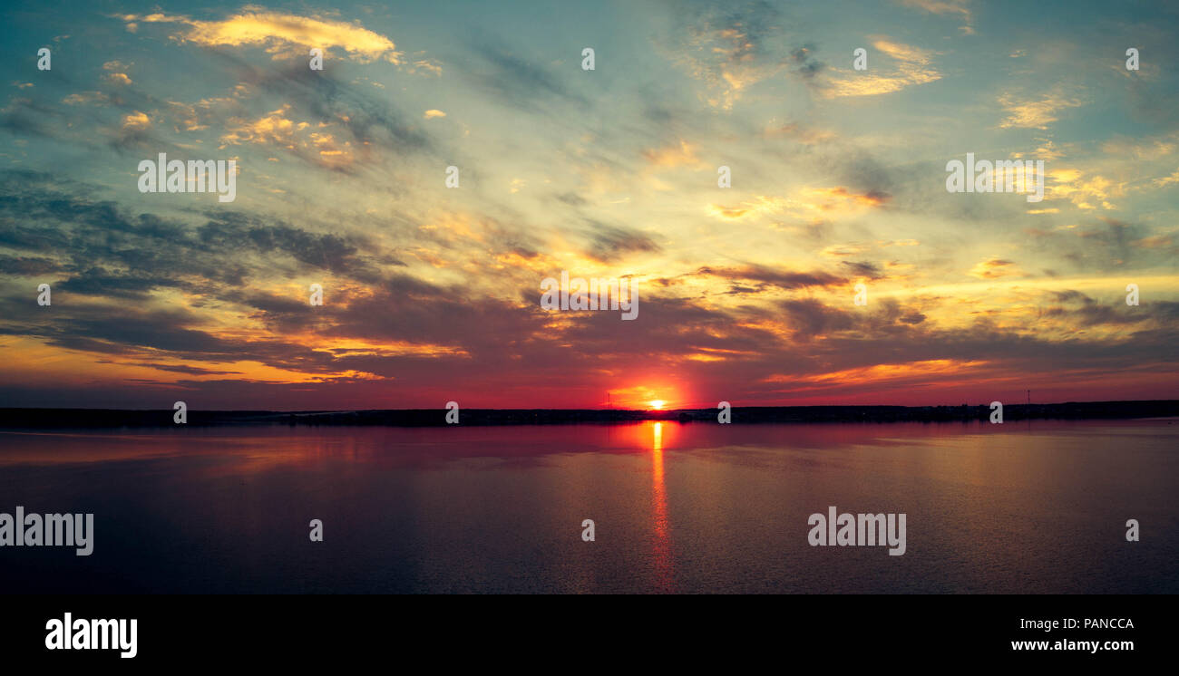 Aerial drone panoramic view of colourful sunset on the lake, sun ...