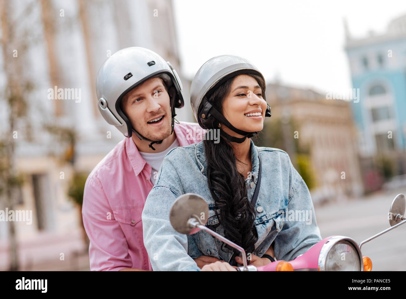 Happy joyful couple having ride Stock Photo - Alamy