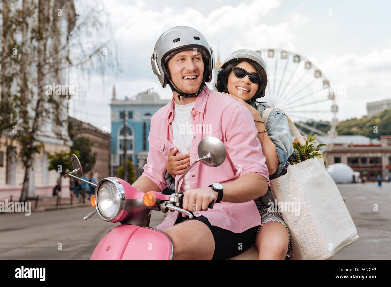 Sweet positive couple driving for products Stock Photo - Alamy