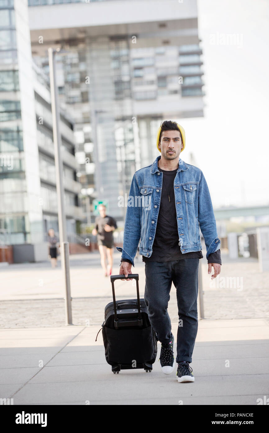 Portrait young man pulling trolley hi-res stock photography and images ...