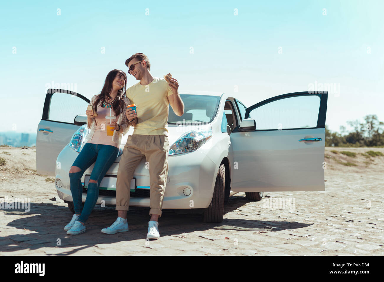 Beaming wife having orange juice while her man drinking coffee Stock ...