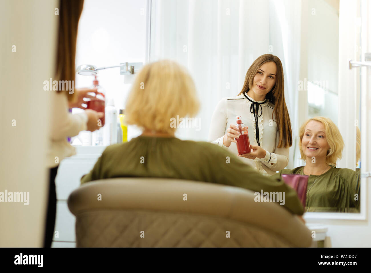 Using hair spray hi-res stock photography and images - Alamy
