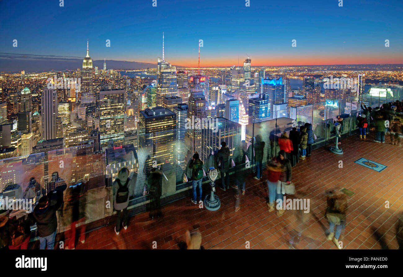 Tourists enjoy a panoramic view of Manhattan from viewing platform at ...