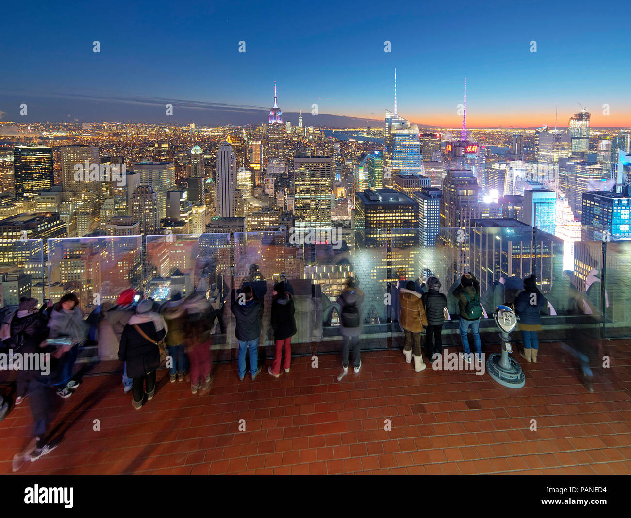 Tourists enjoy a panoramic view of Manhattan from viewing platform at ...