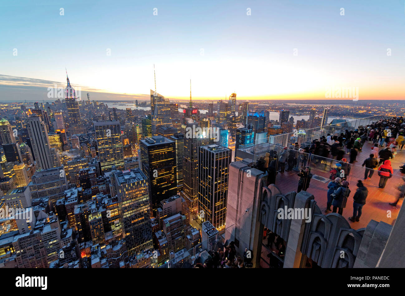 Tourists enjoy a panoramic view of Manhattan from viewing platform at ...