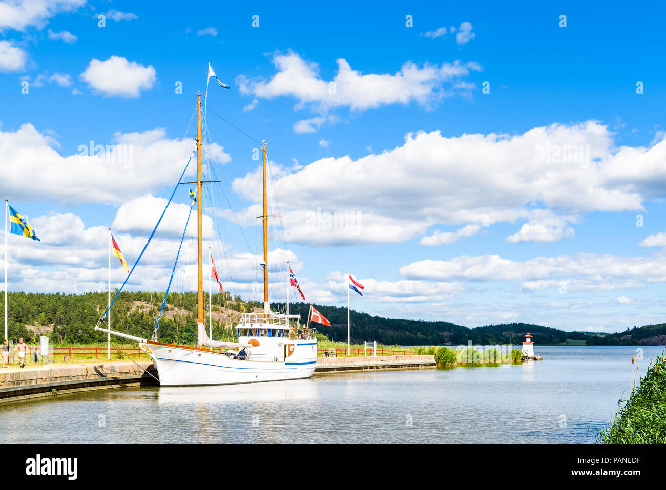 Mem, Sweden - June 29, 2018: White boat with Danish flag, anchored to ...