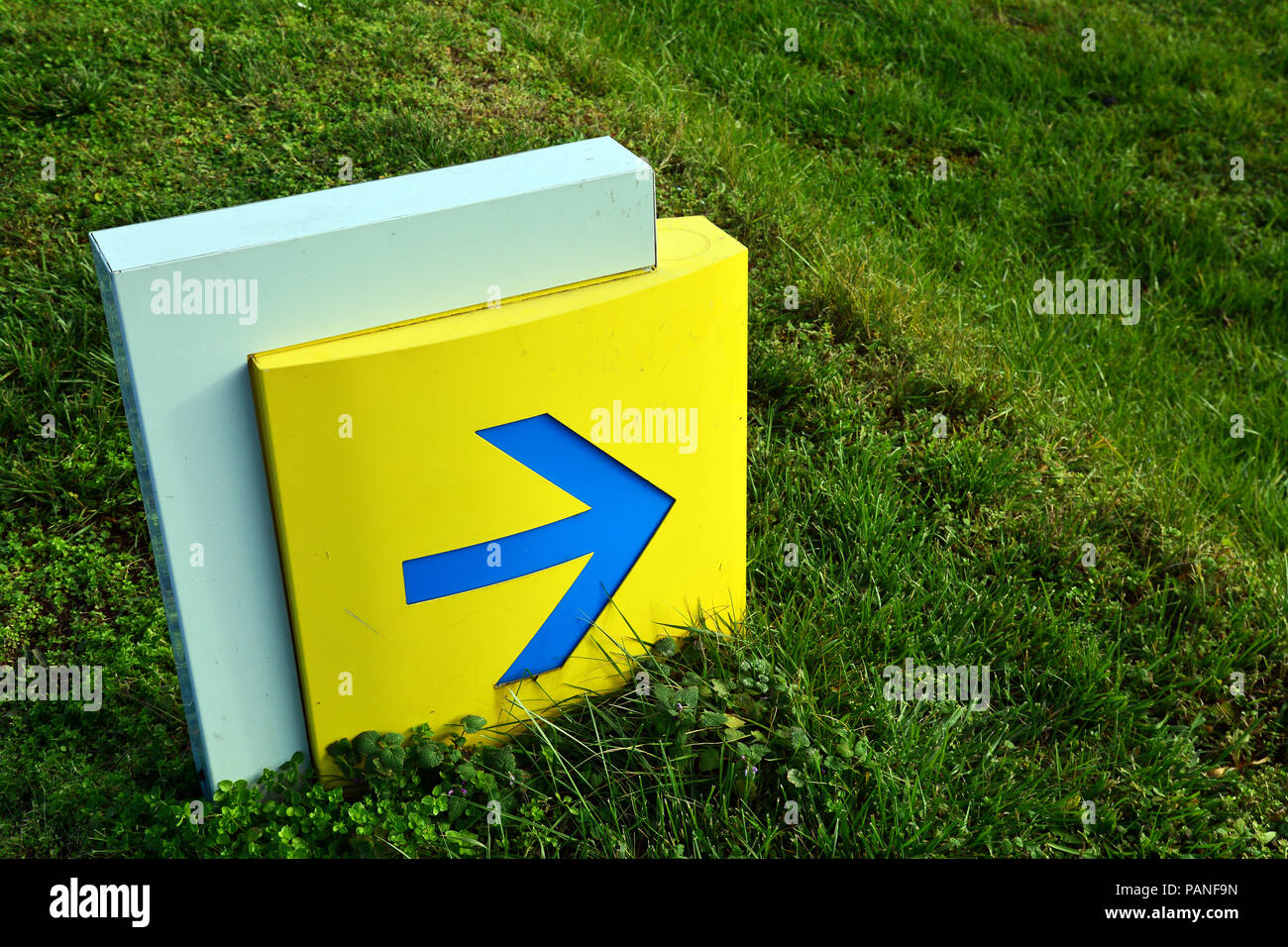 traffic sign, blue arrow showing direction Stock Photo - Alamy