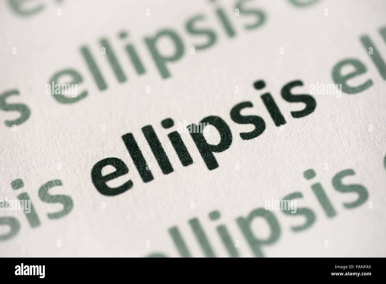 word ellipsis printed on white paper macro Stock Photo - Alamy