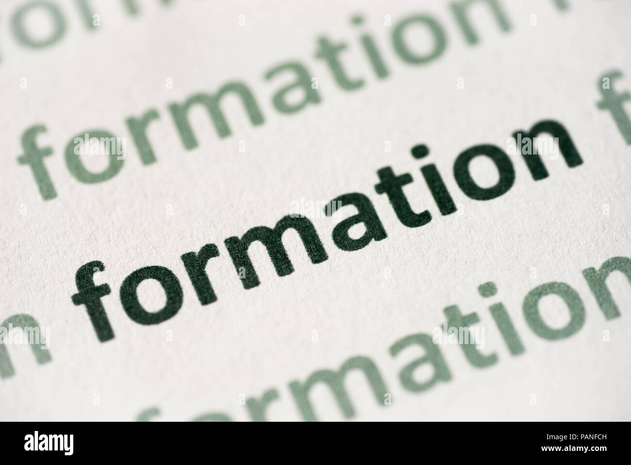 word formation printed on white paper macro Stock Photo - Alamy