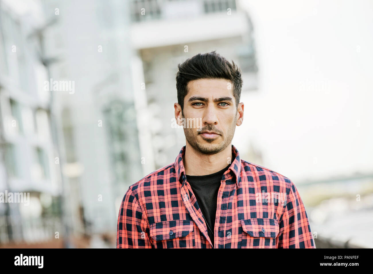 Portrait of young man with stubble Stock Photo - Alamy