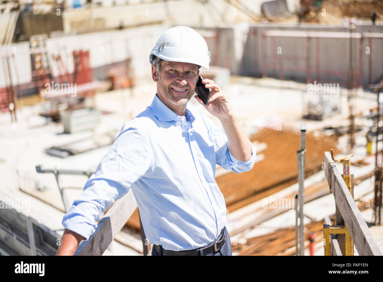 Man hard hat phone hi-res stock photography and images - Alamy