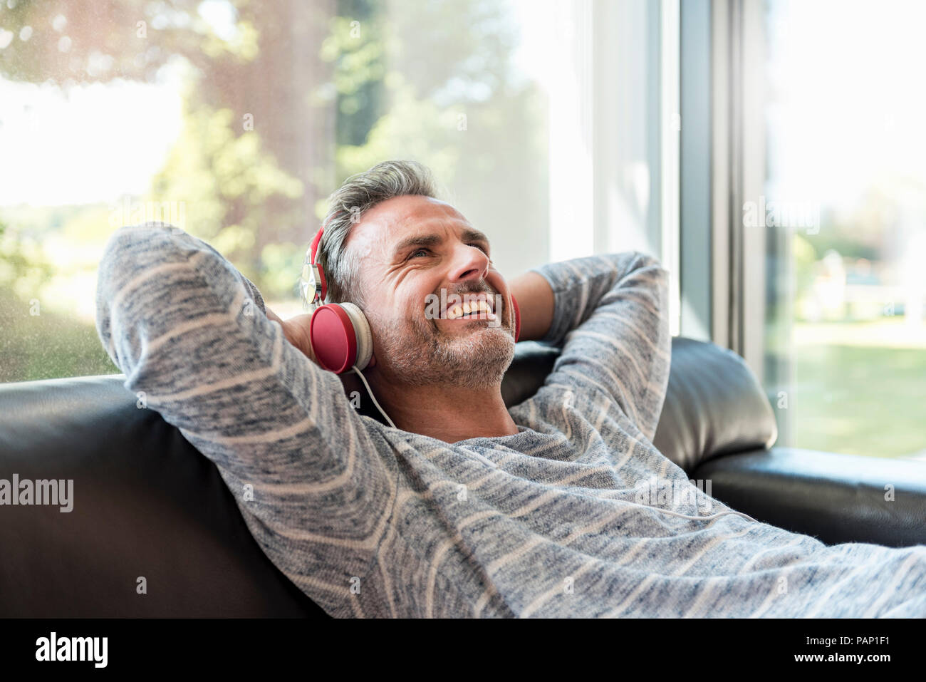 Man lying down on couch hi-res stock photography and images - Alamy