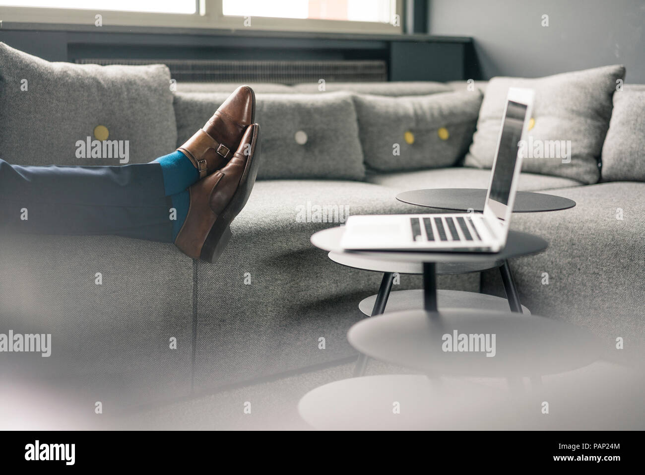 Feet on couch hi-res stock photography and images - Alamy