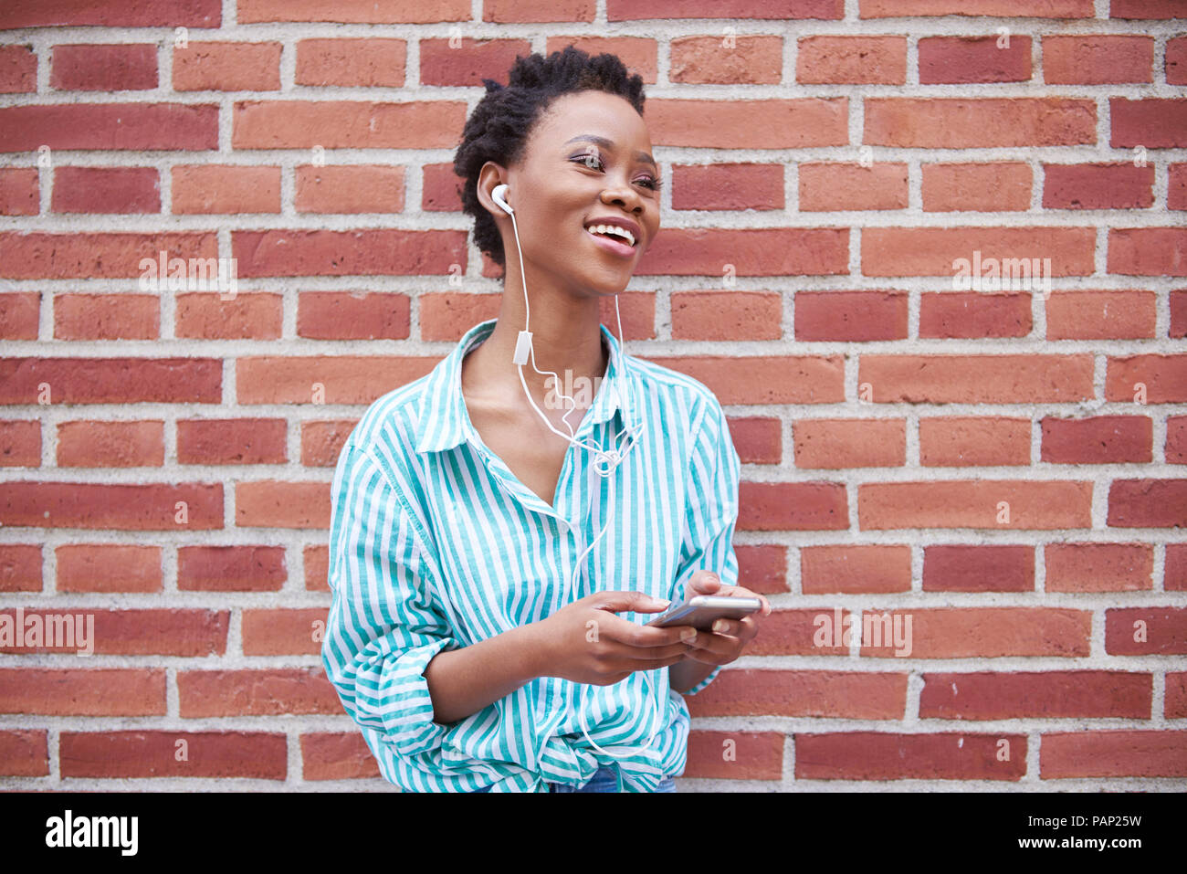 Using earphones hi-res stock photography and images - Alamy