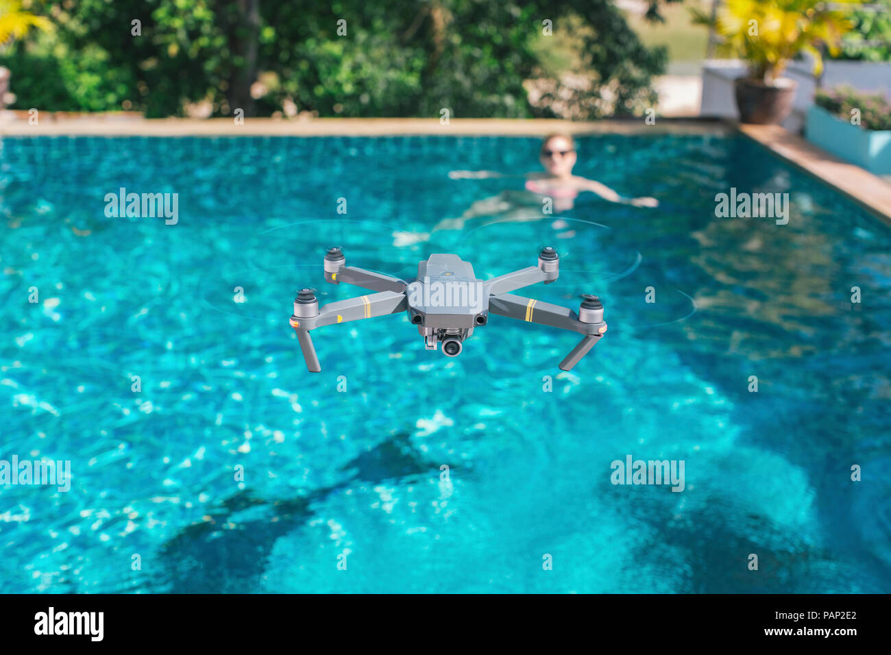 Flying drone over swimming pool hi-res stock photography and images - Alamy
