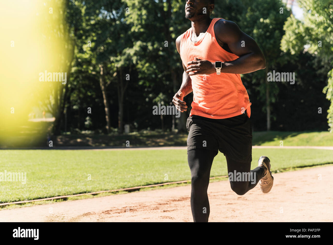 Young athlete on sports field training running Stock Photo - Alamy