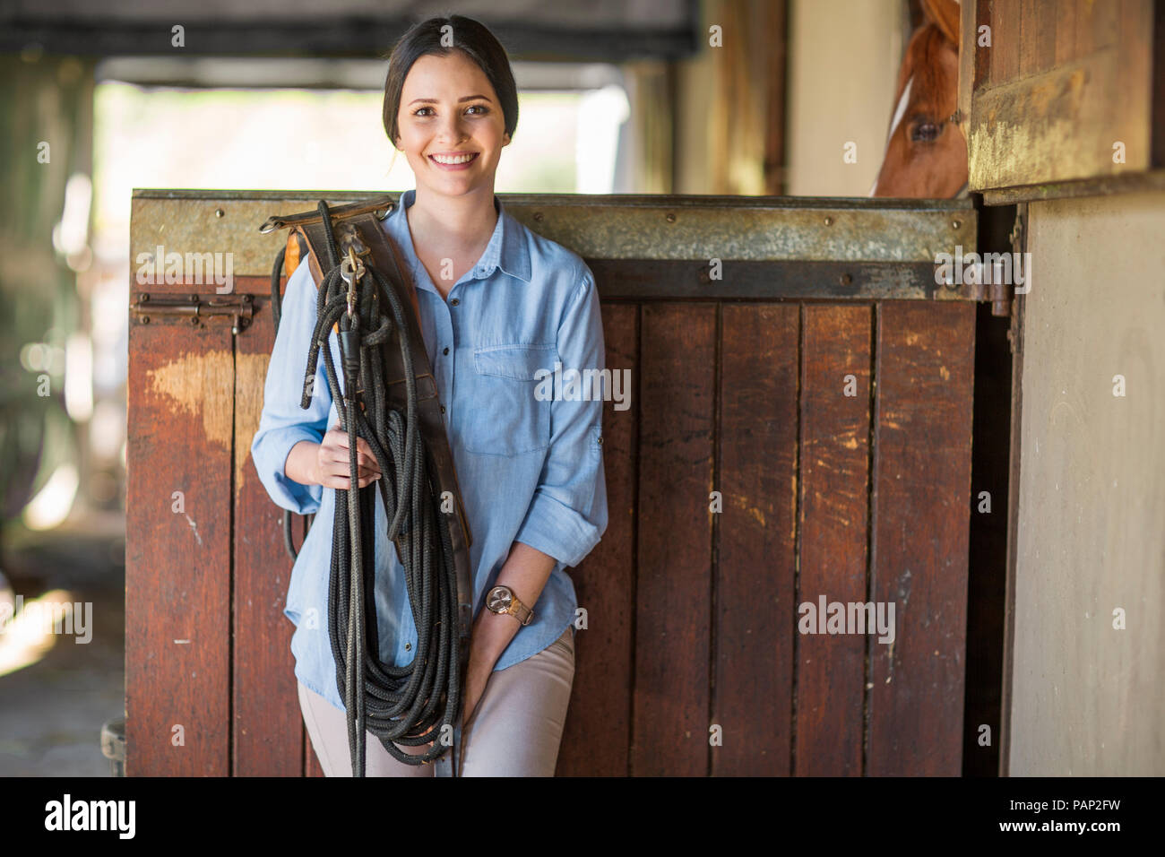 Woman in stables hi-res stock photography and images - Alamy