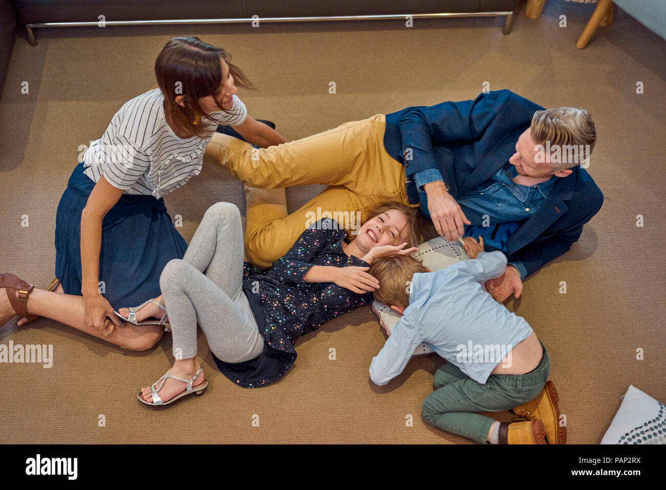 Happy children lie on floor hi-res stock photography and images - Alamy
