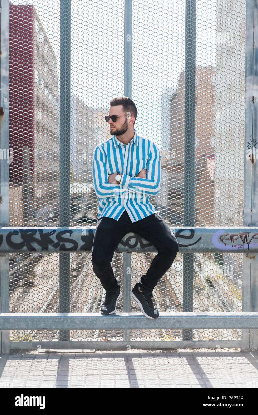 Man sitting fence hi-res stock photography and images - Alamy
