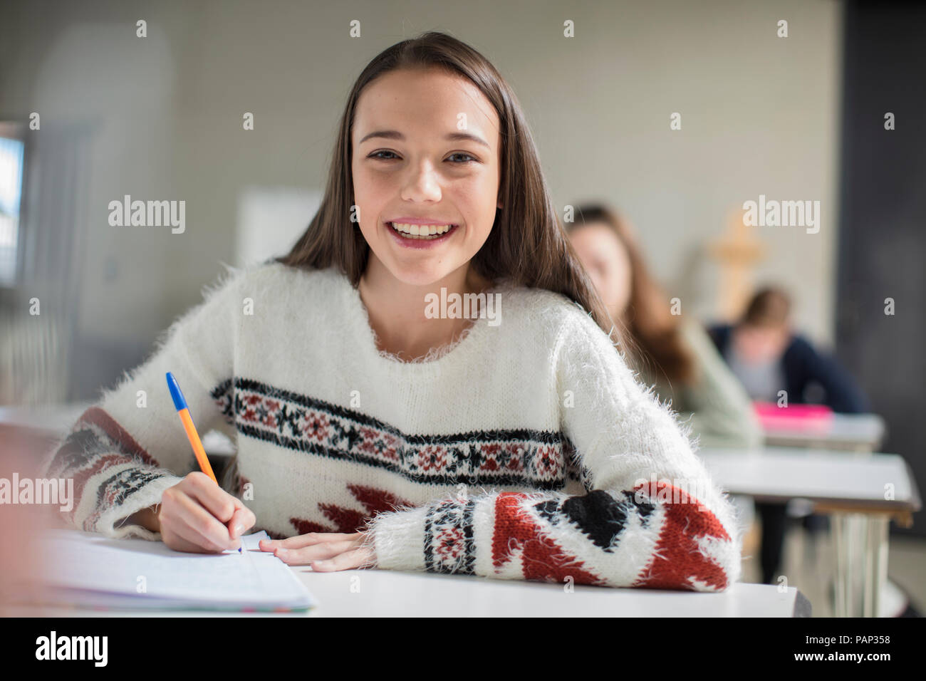 Happy students in classrooms hi-res stock photography and images - Alamy