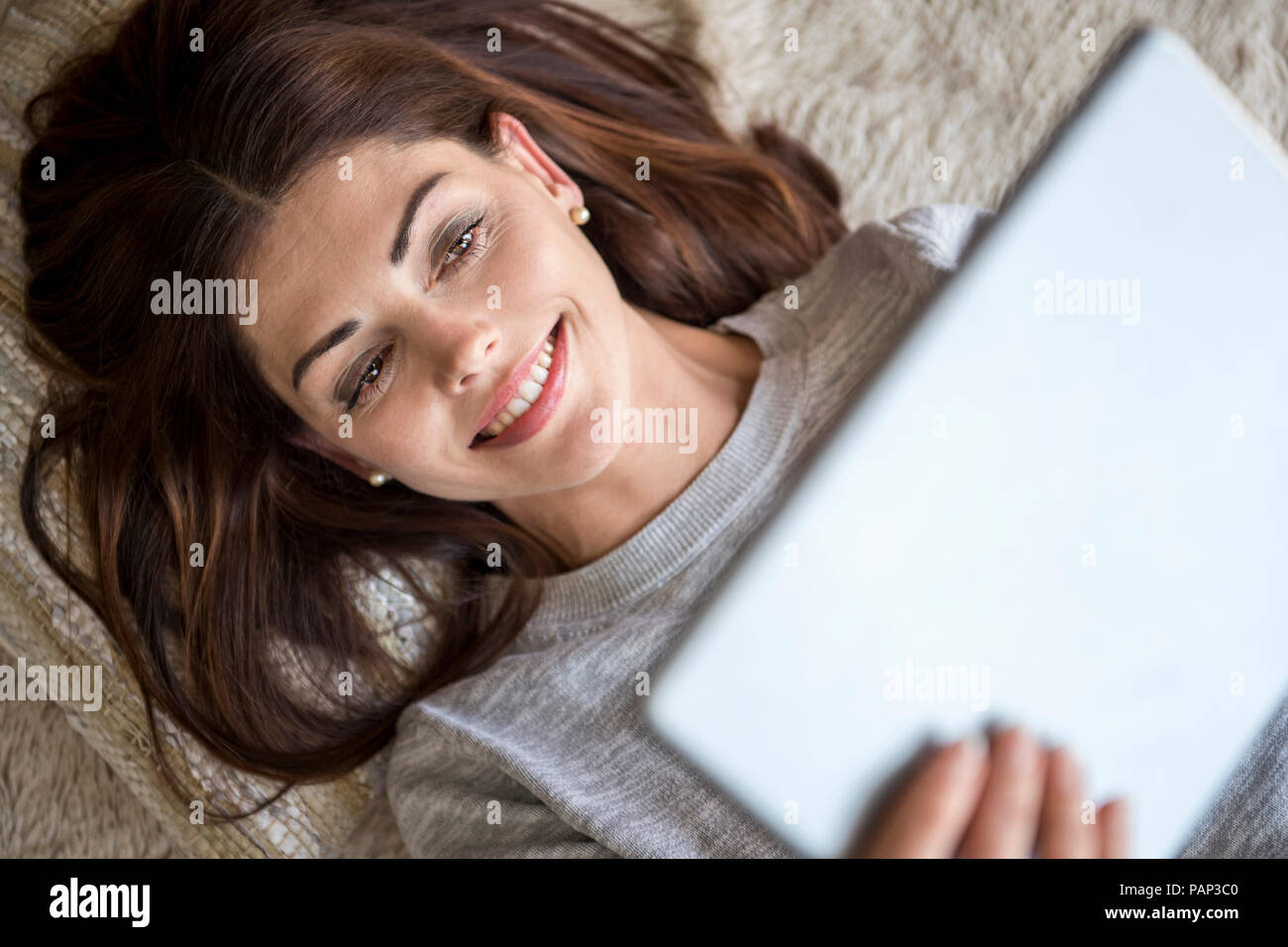 Woman lying down on carpet top view hi-res stock photography and images ...