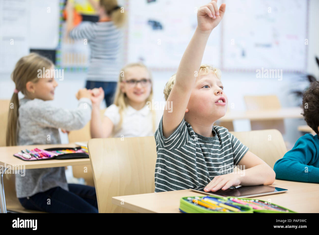 Child raising hand hi-res stock photography and images - Alamy