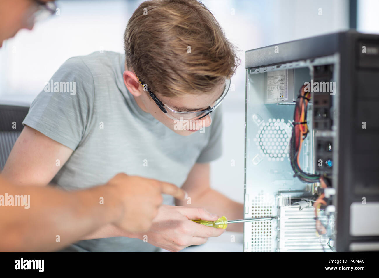 Students assembling computer in class Stock Photo - Alamy
