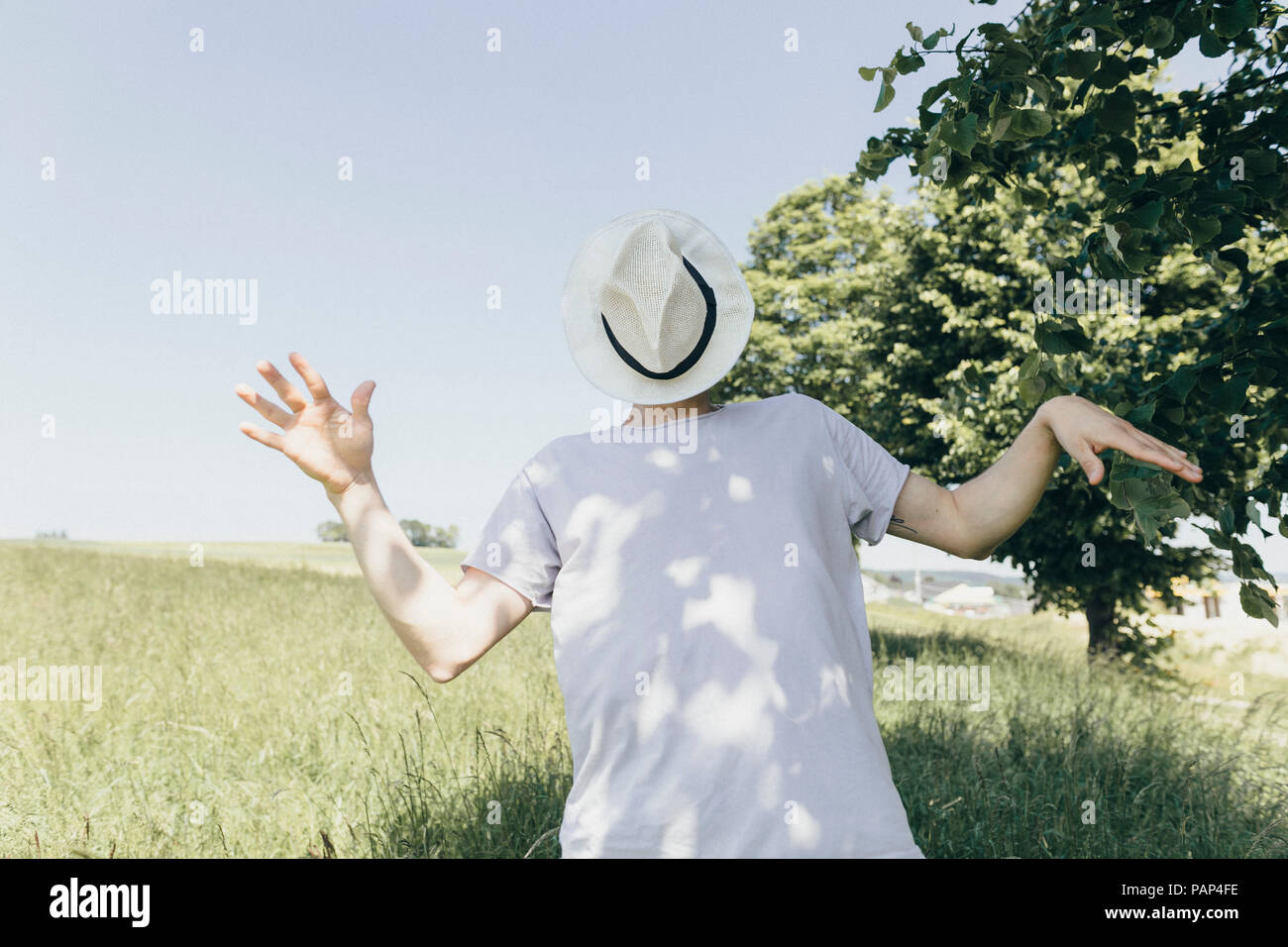 Man with hat covering face hi-res stock photography and images - Alamy