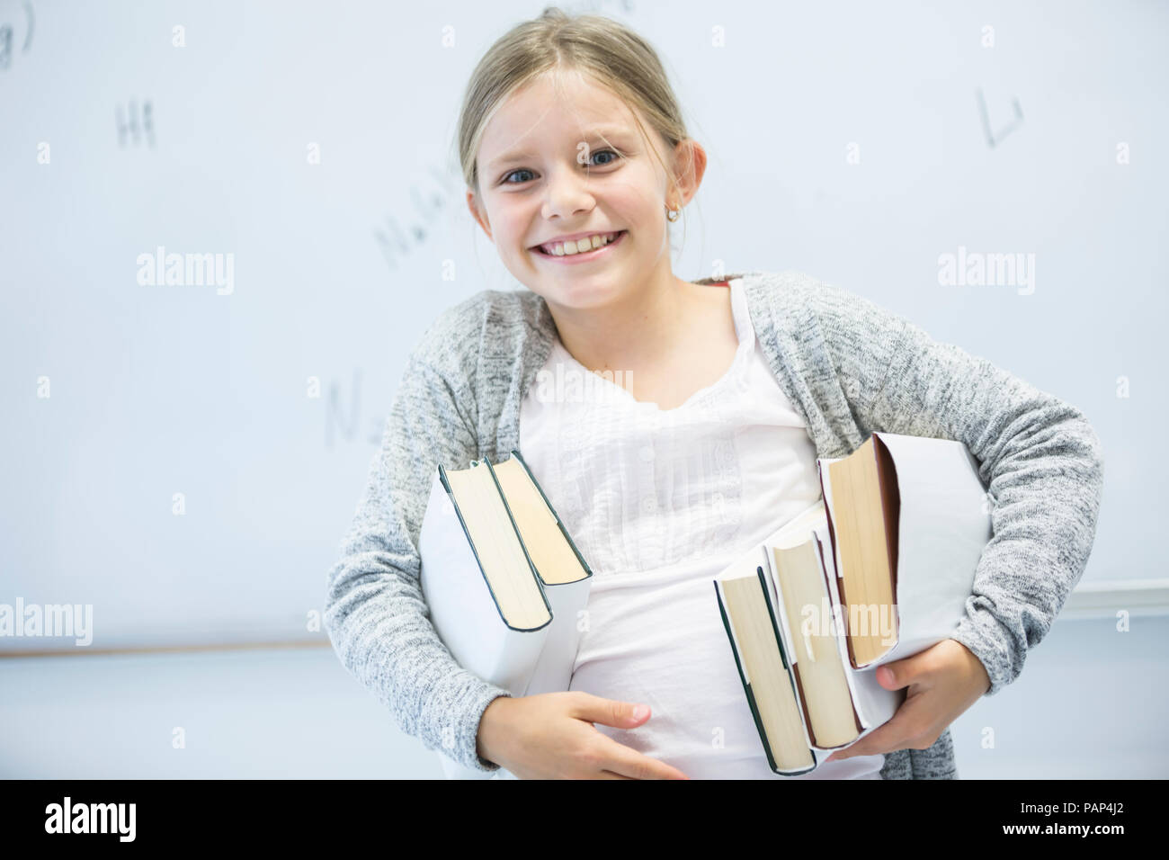 Girl school books carrying hi-res stock photography and images - Alamy