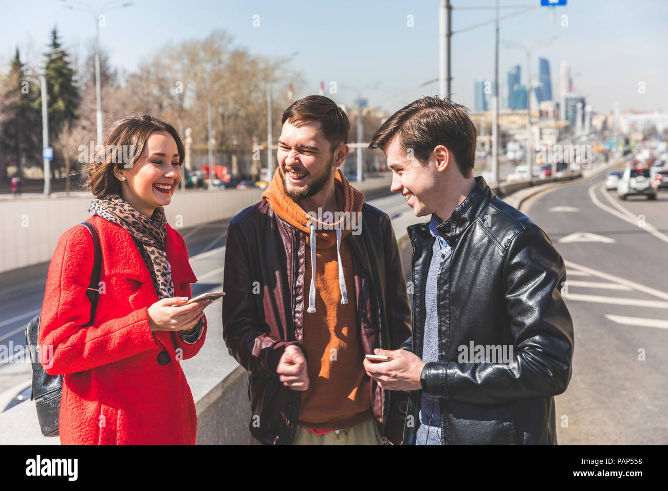 Russia, Moscow, group of friends talking next to a road Stock Photo - Alamy