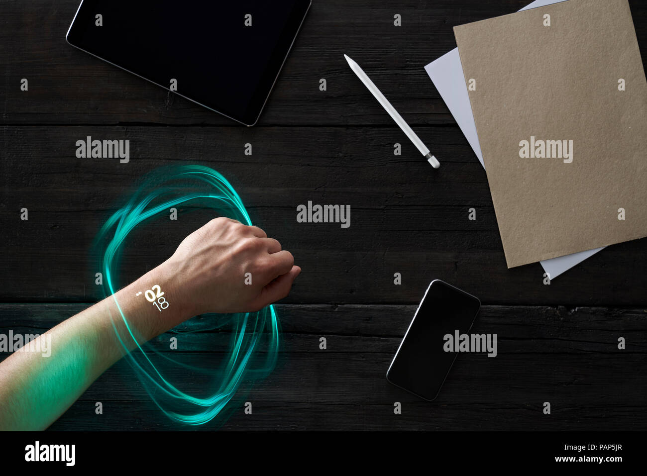 Futuristic smartwatch on wrist connecting to portable devices Stock ...