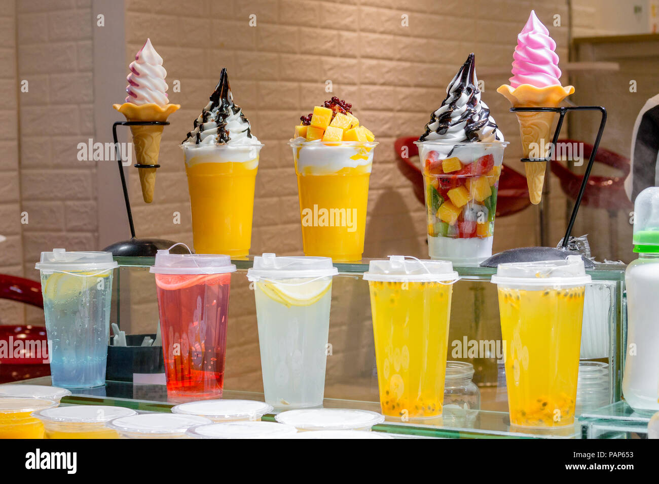 Section of freshly prepared ice cream and cold juices from tropical ...