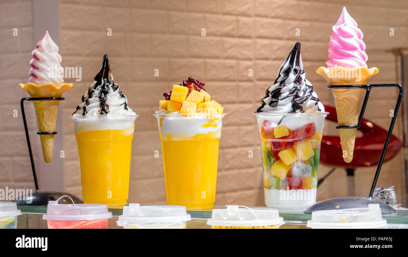 Section of freshly prepared ice cream and cold juices from tropical ...