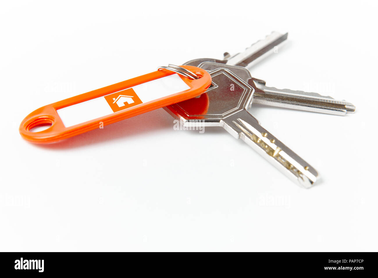 Key ring with keys over white background. Rent, buy Stock Photo - Alamy