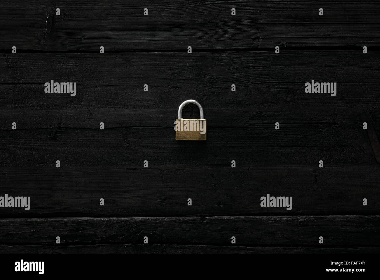 Lock on black background Stock Photo - Alamy