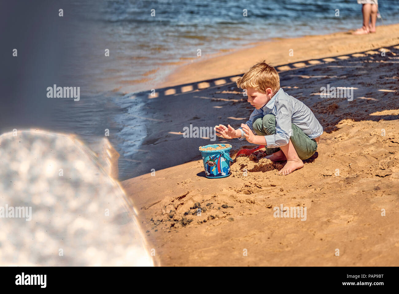 Boy playing in sand hi-res stock photography and images - Alamy