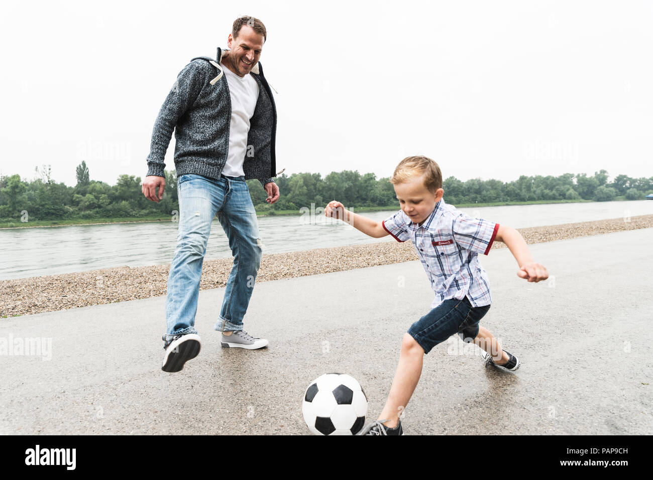 Father and son playing football hi-res stock photography and images - Alamy